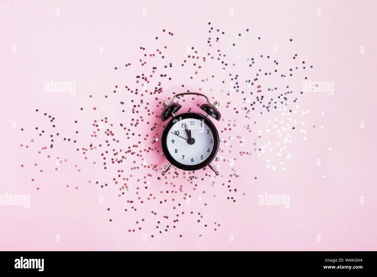 New Year or Christmas concept with clock showing around twelve pm and ...