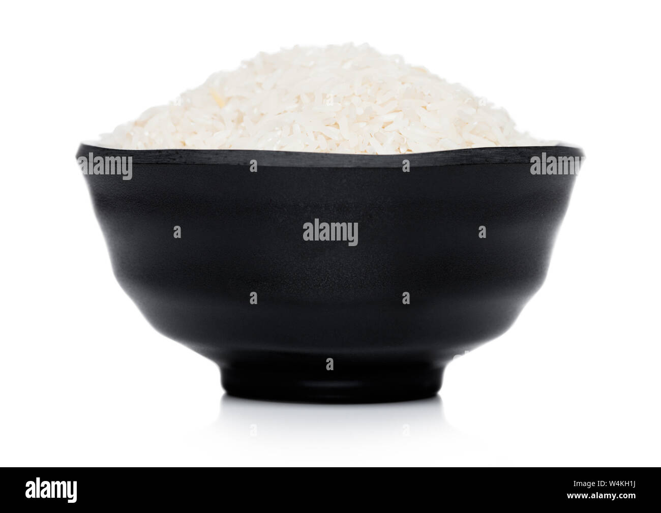 Black bowl of raw organic basmati rice on white background Stock Photo ...
