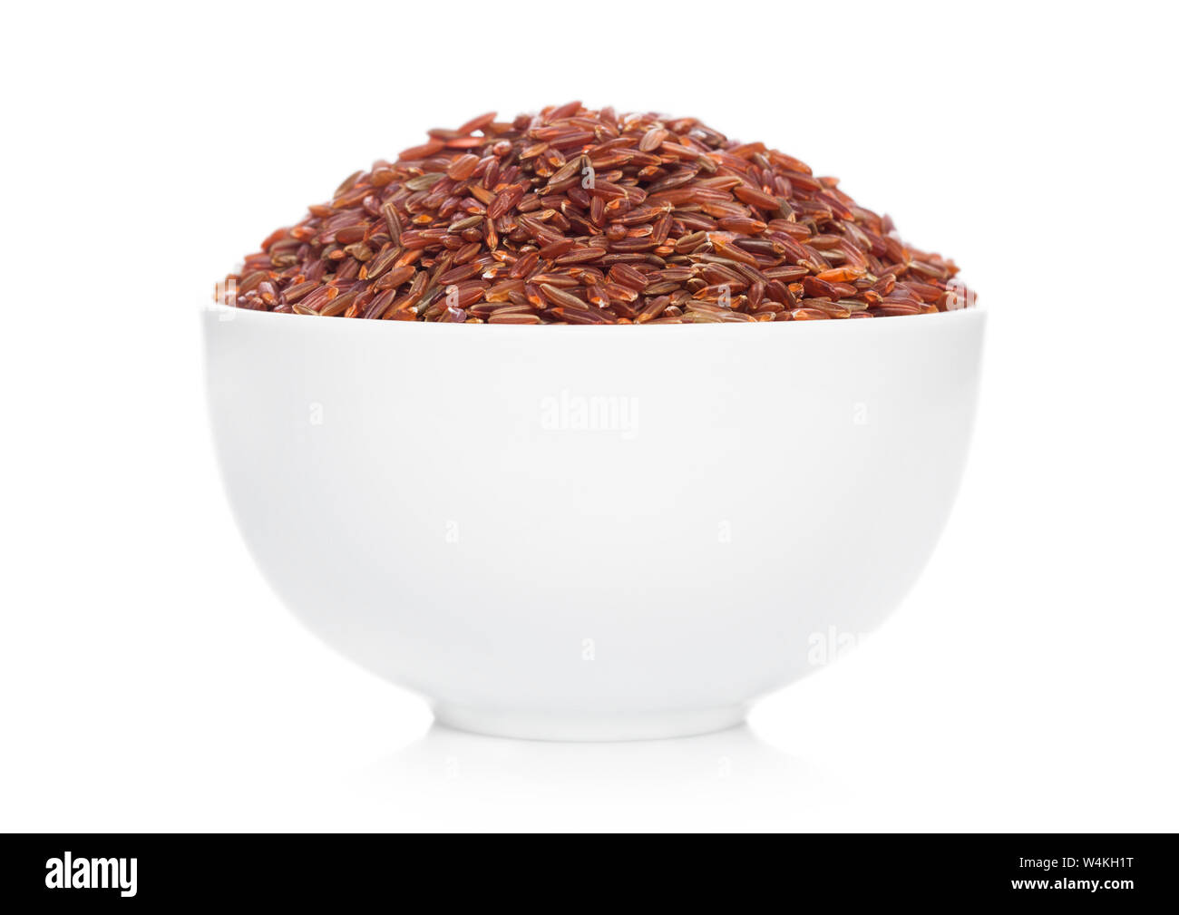 White bowl of raw organic red rice on white background Stock Photo - Alamy