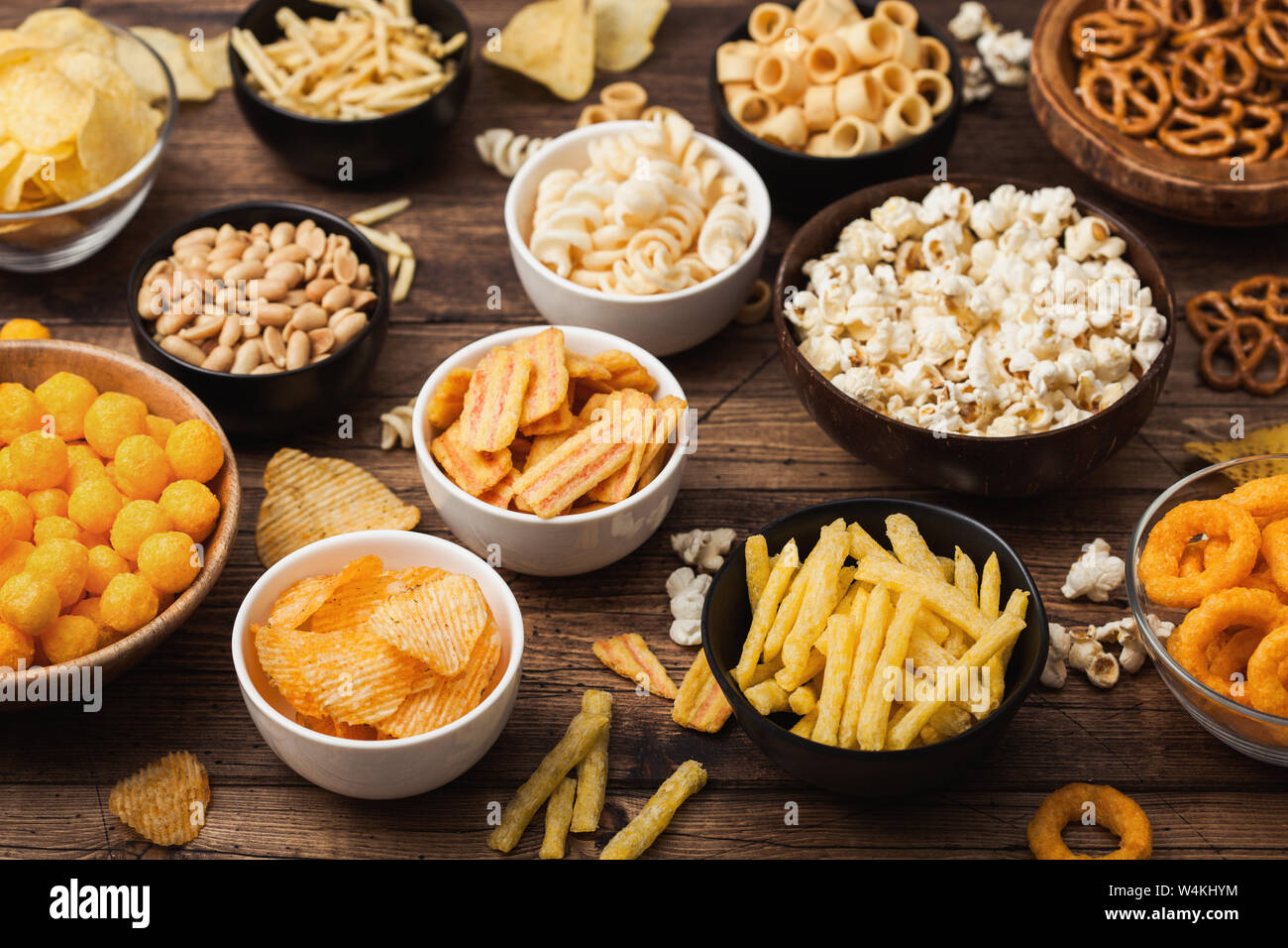 All classic potato snacks with peanuts, popcorn and onion rings and ...