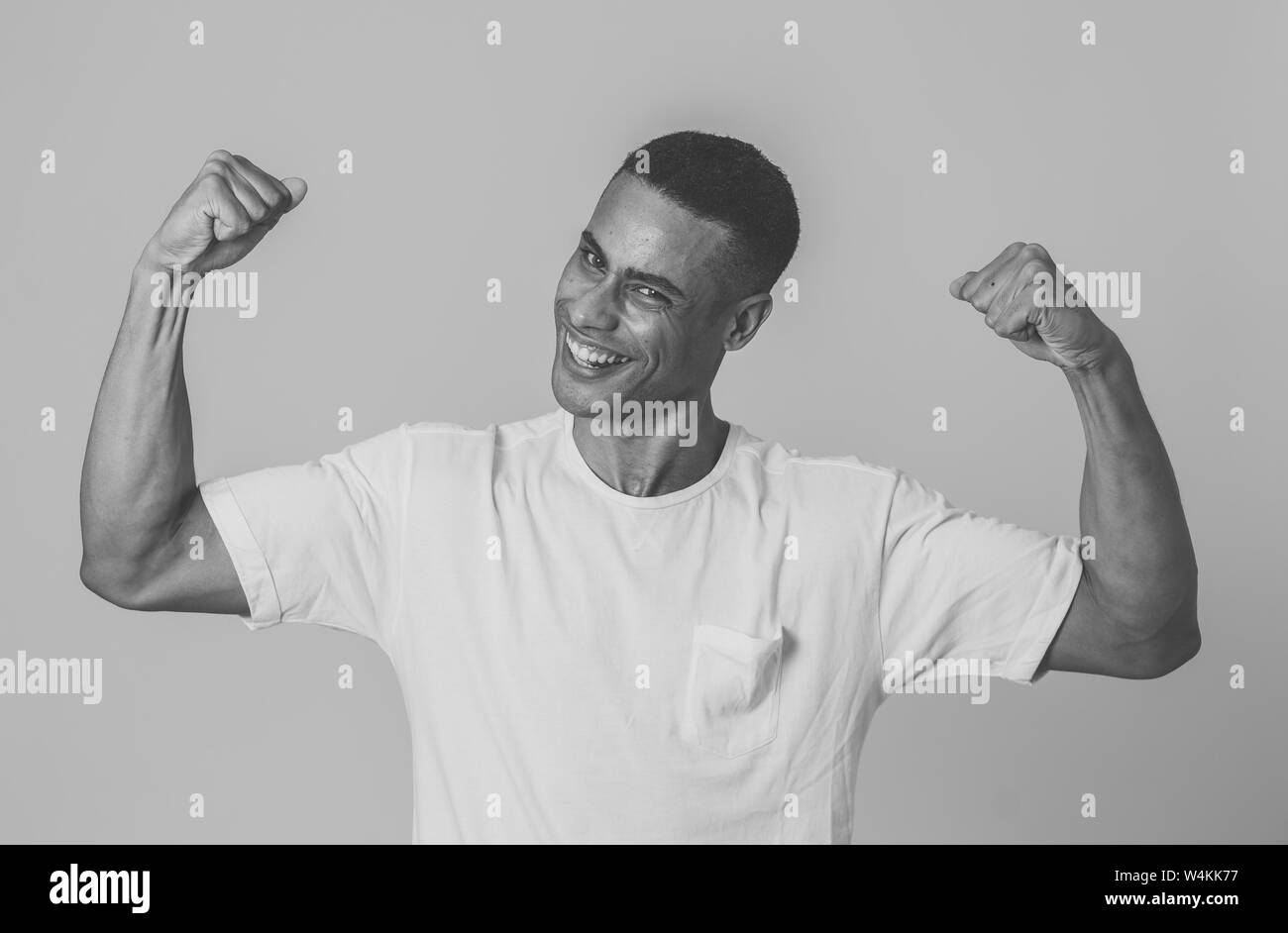 Confident handsome male showing Black and White Stock Photos & Images ...