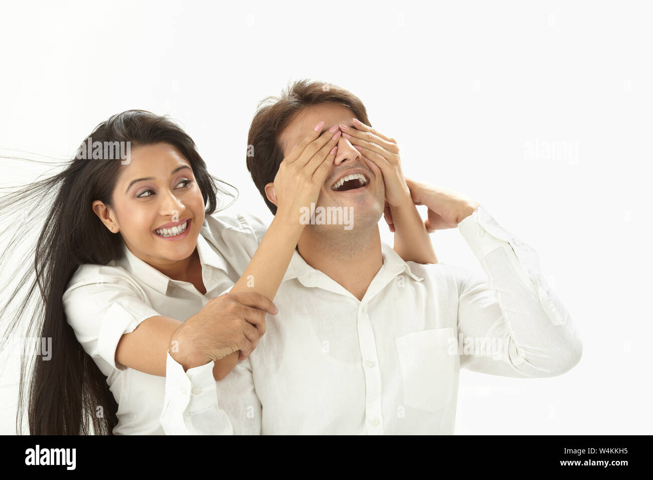 Indian man covering wife eyes hi-res stock photography and images - Alamy