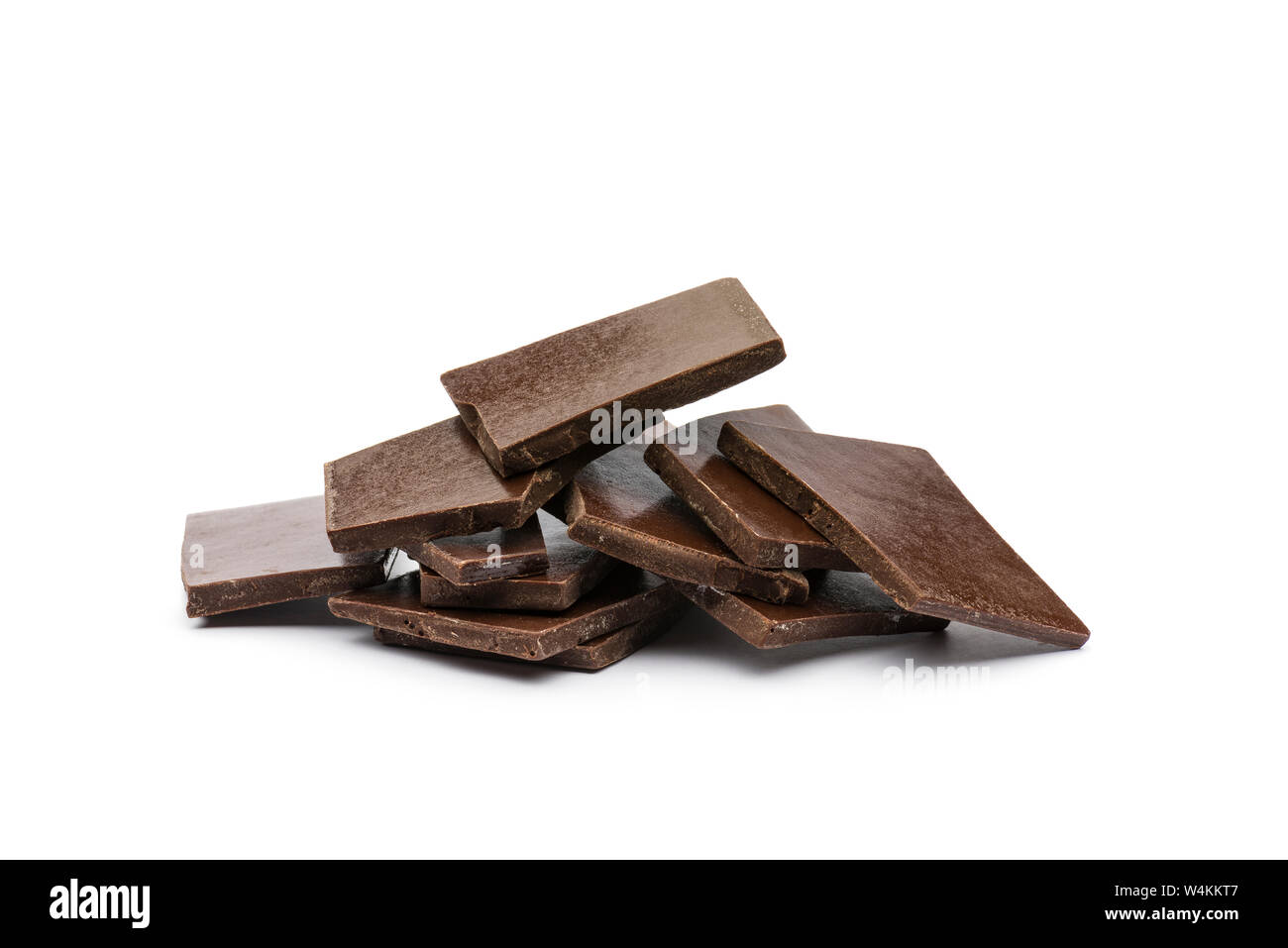 dark chocolate chunks on white background Stock Photo - Alamy