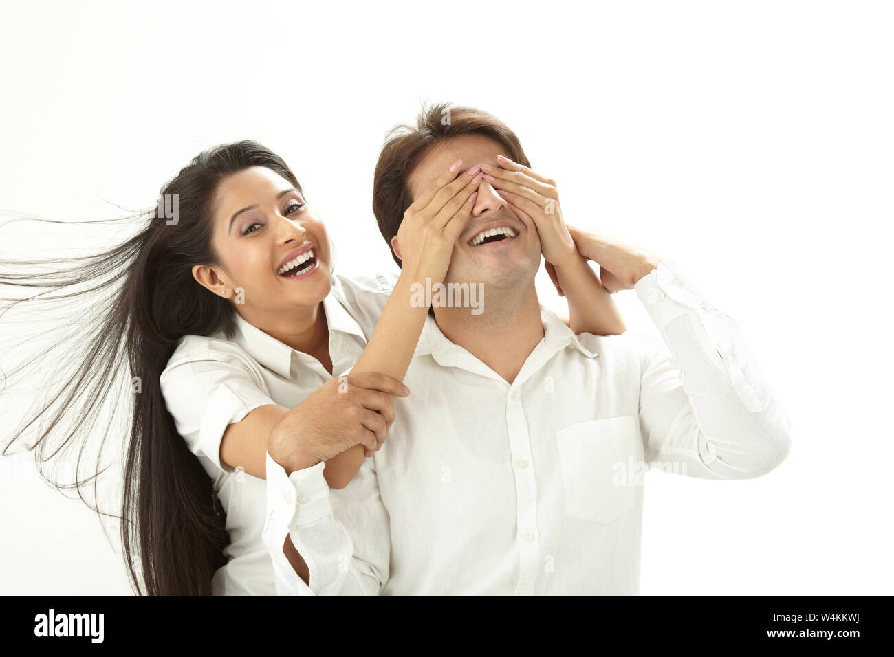 Indian man covering wife eyes hi-res stock photography and images - Alamy