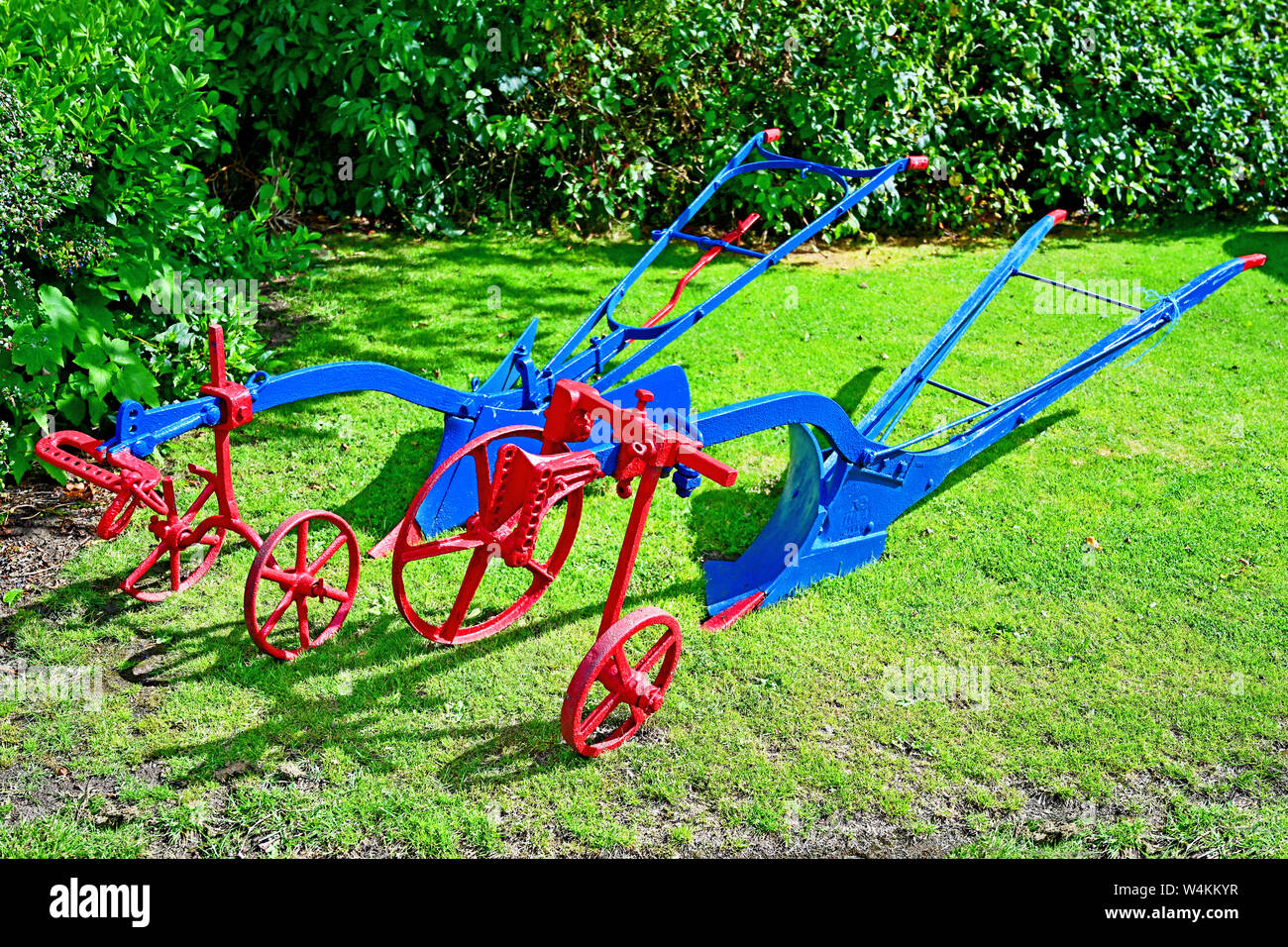 Red and blue horse plough and seed drill Stock Photo - Alamy
