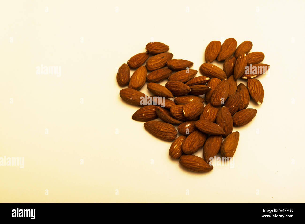 almonds arranges in a heart shape - healthy food concept Stock Photo ...