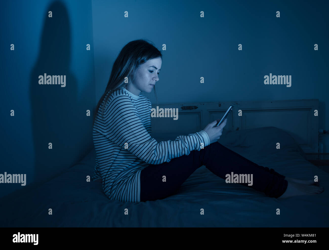 Young teenager girl suffering mobile cell phone addiction feeling ...