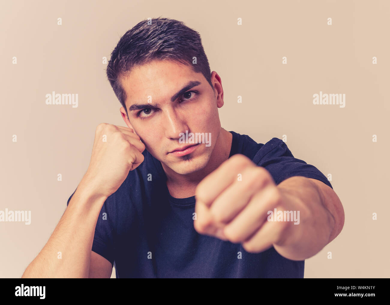 Close up portrait of an attractive young man with angry face looking ...