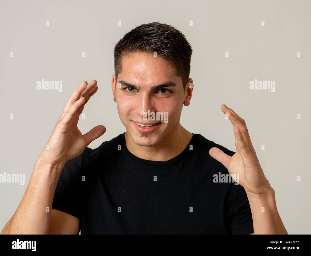 Portrait of frustrated mixed race young man with angry and stressed ...
