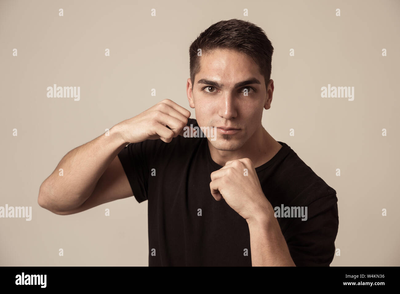 Close up portrait of an attractive young man with angry face looking ...