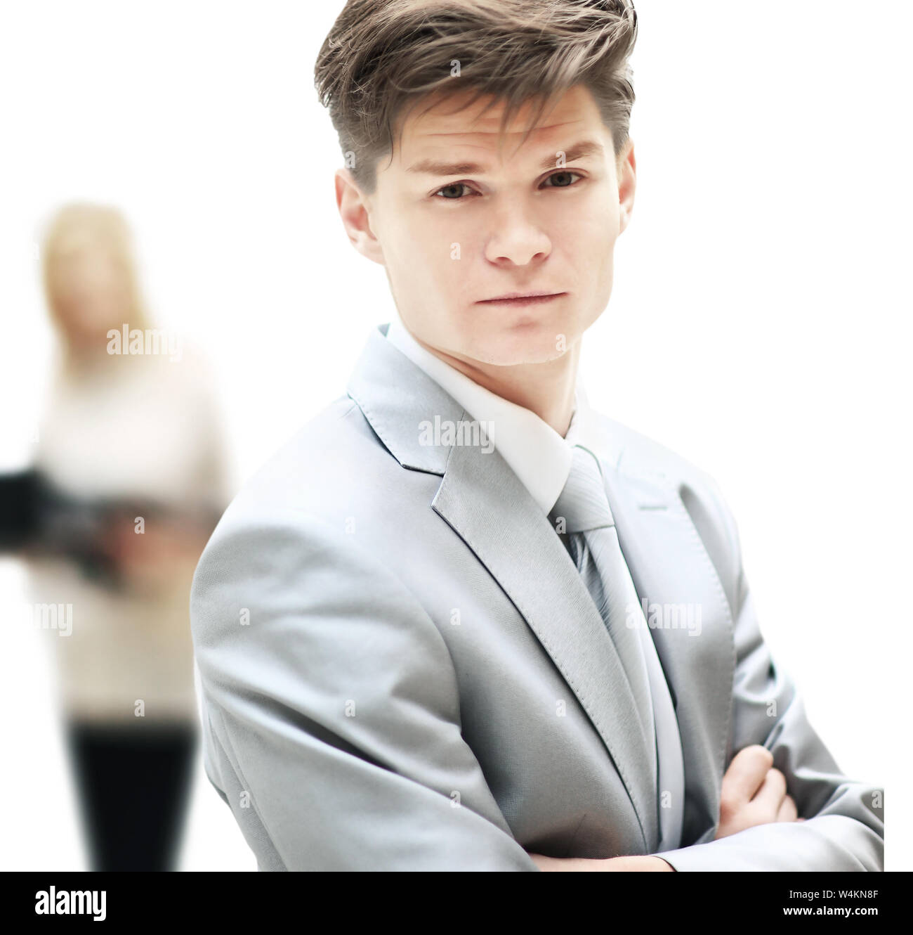 Portrait of a serious handsome business man on the background of team ...
