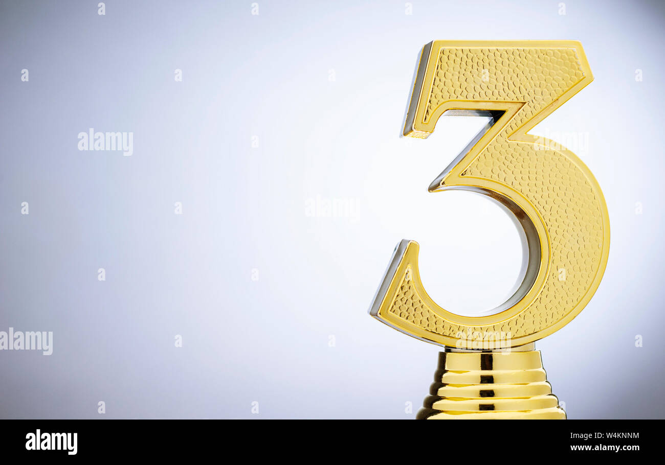 3rd placed runner up metallic gold trophy with a 3D number 3 on white ...