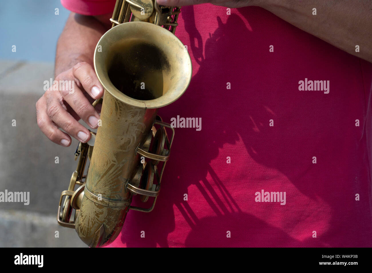 Musician hands while playing saxophone detail Stock Photo - Alamy