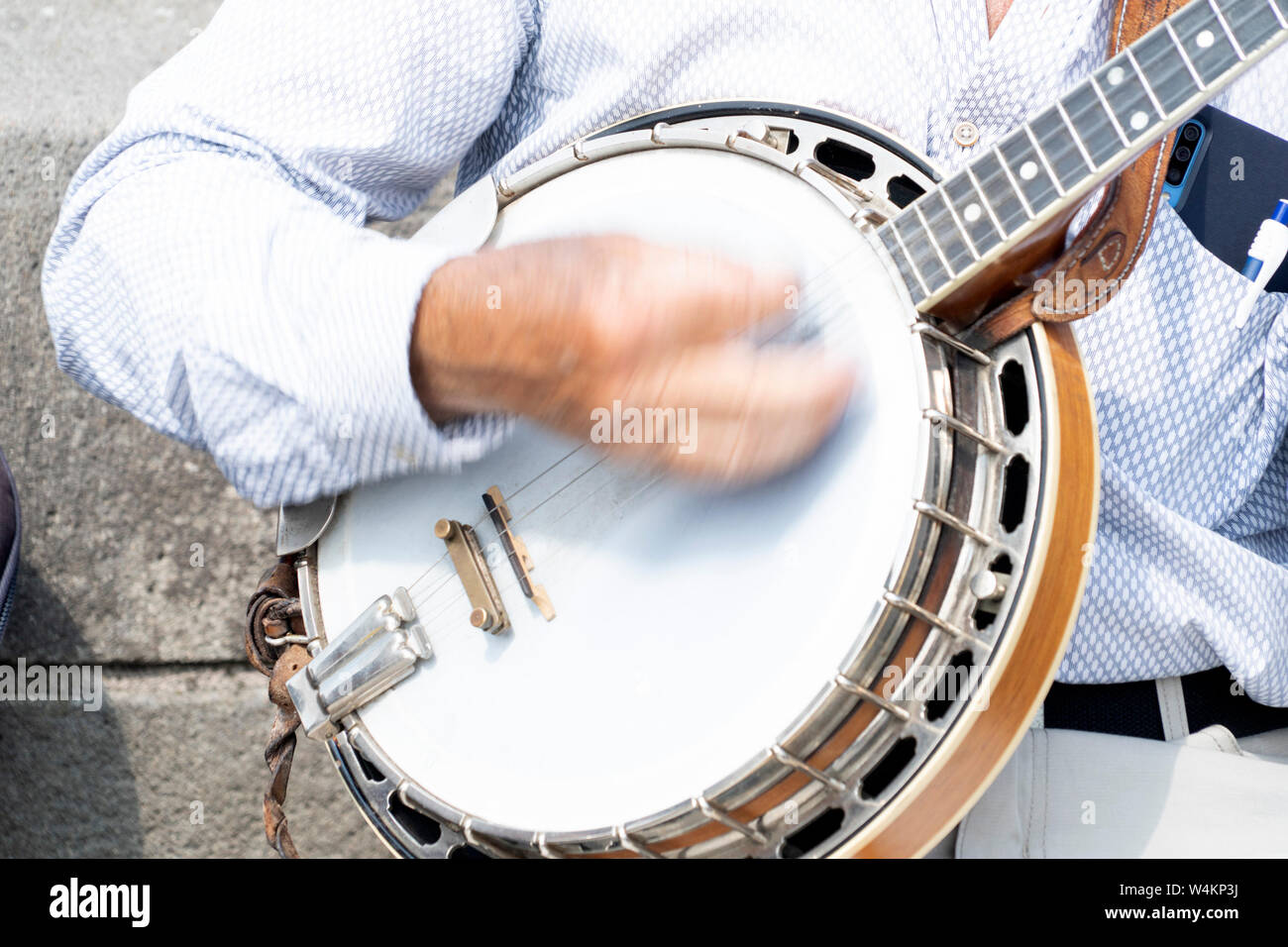 street artist playing banjo musician detail of hands close up Stock ...