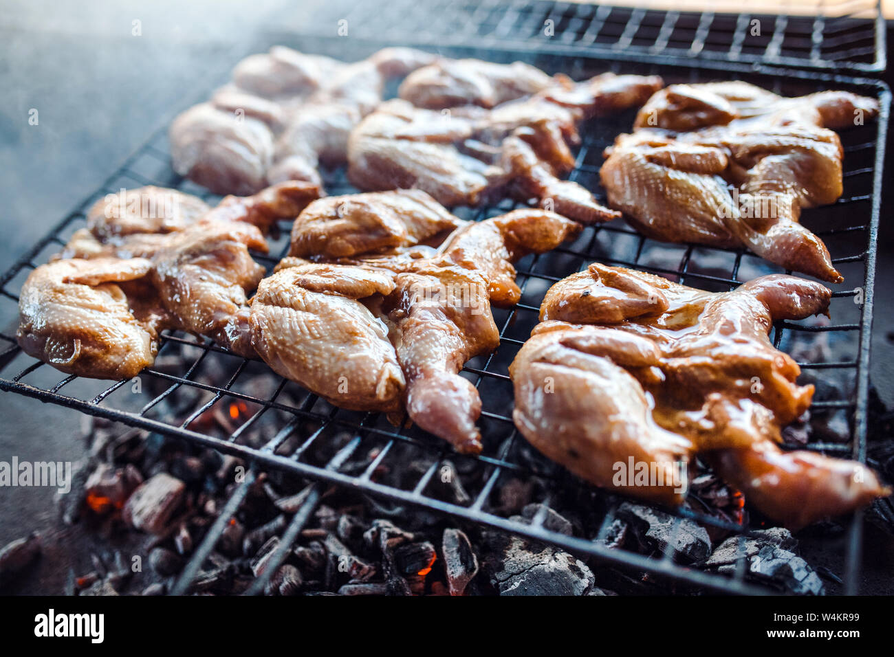 Quails on the grill. Grilled chicken meat Stock Photo - Alamy