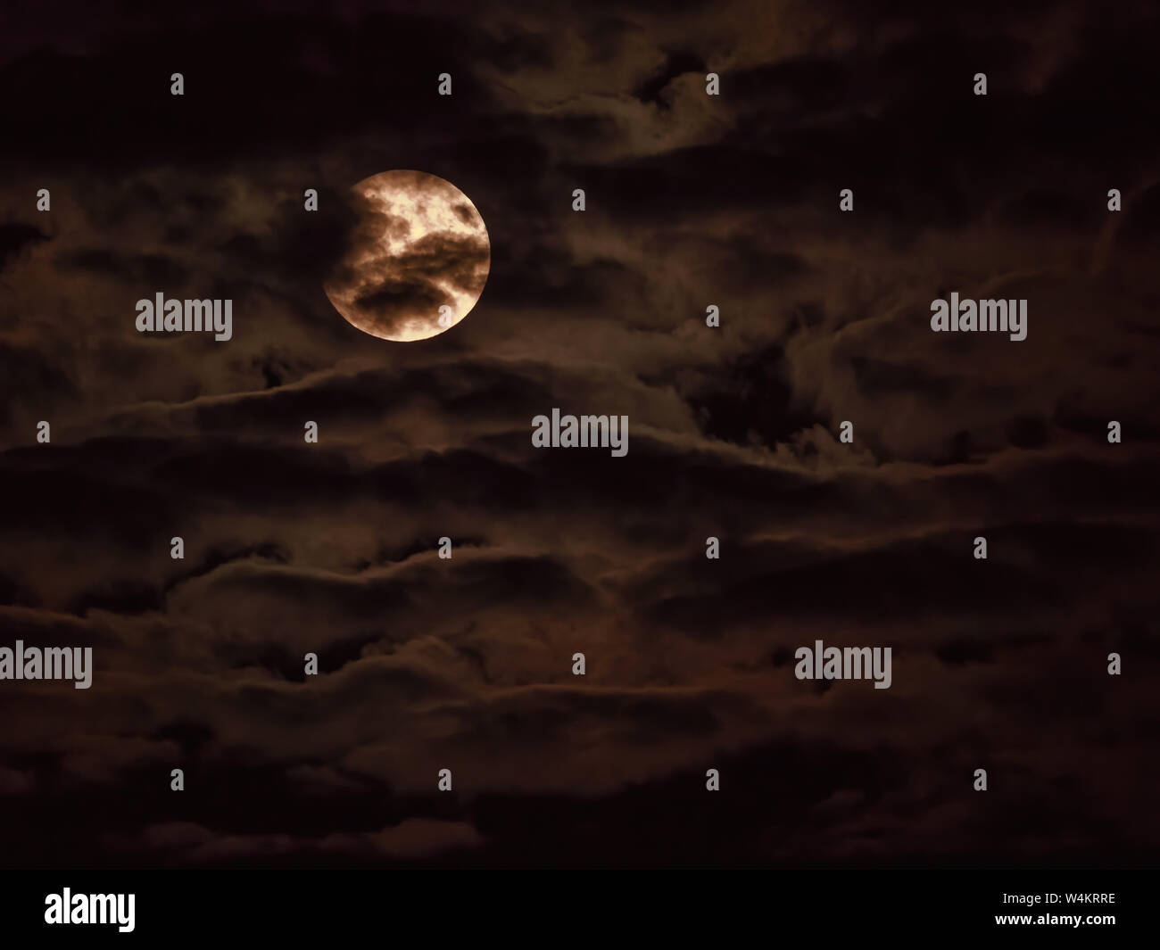 Moon covered by light cloud hi-res stock photography and images - Alamy