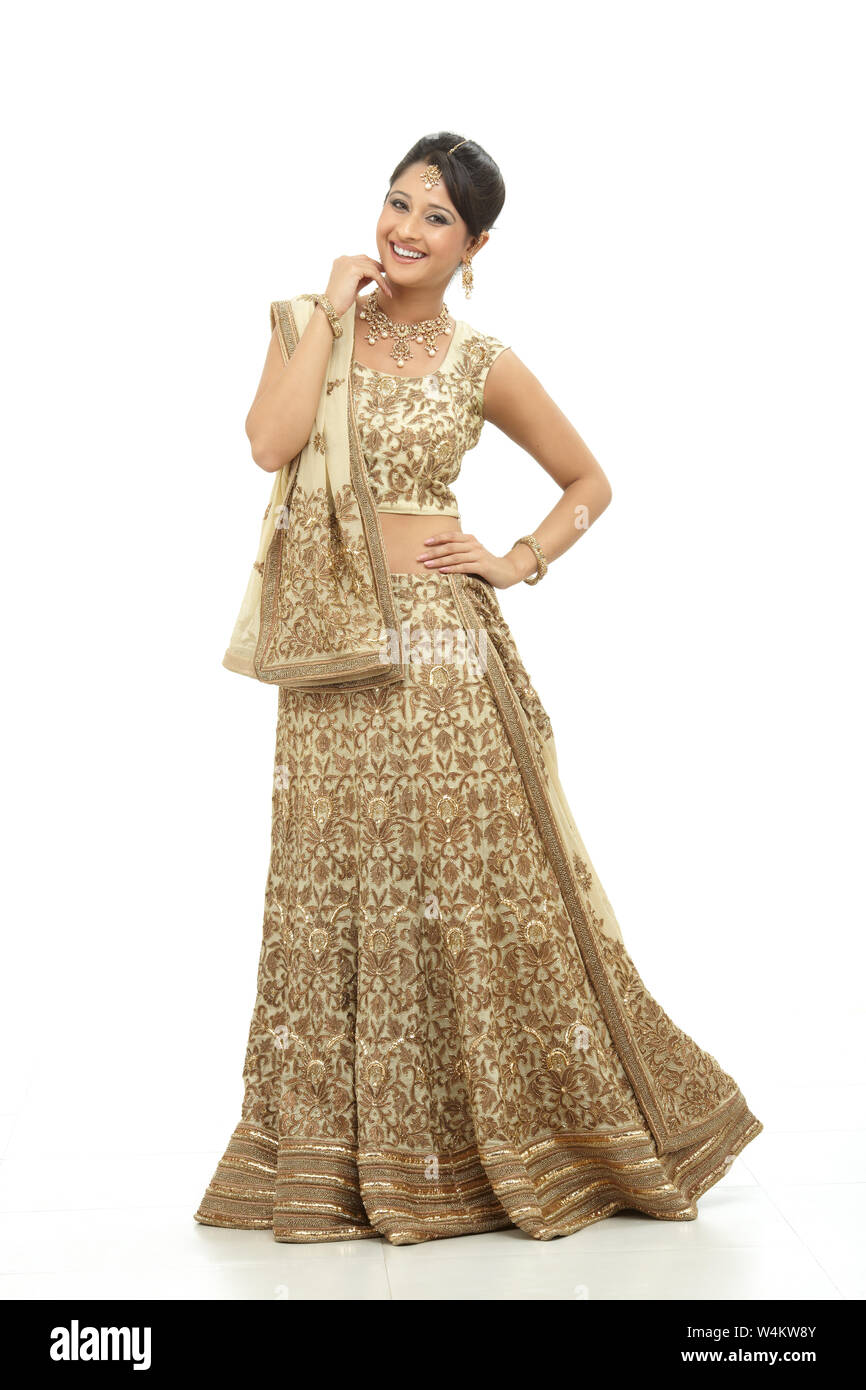 Indian bride standing and smiling Stock Photo - Alamy