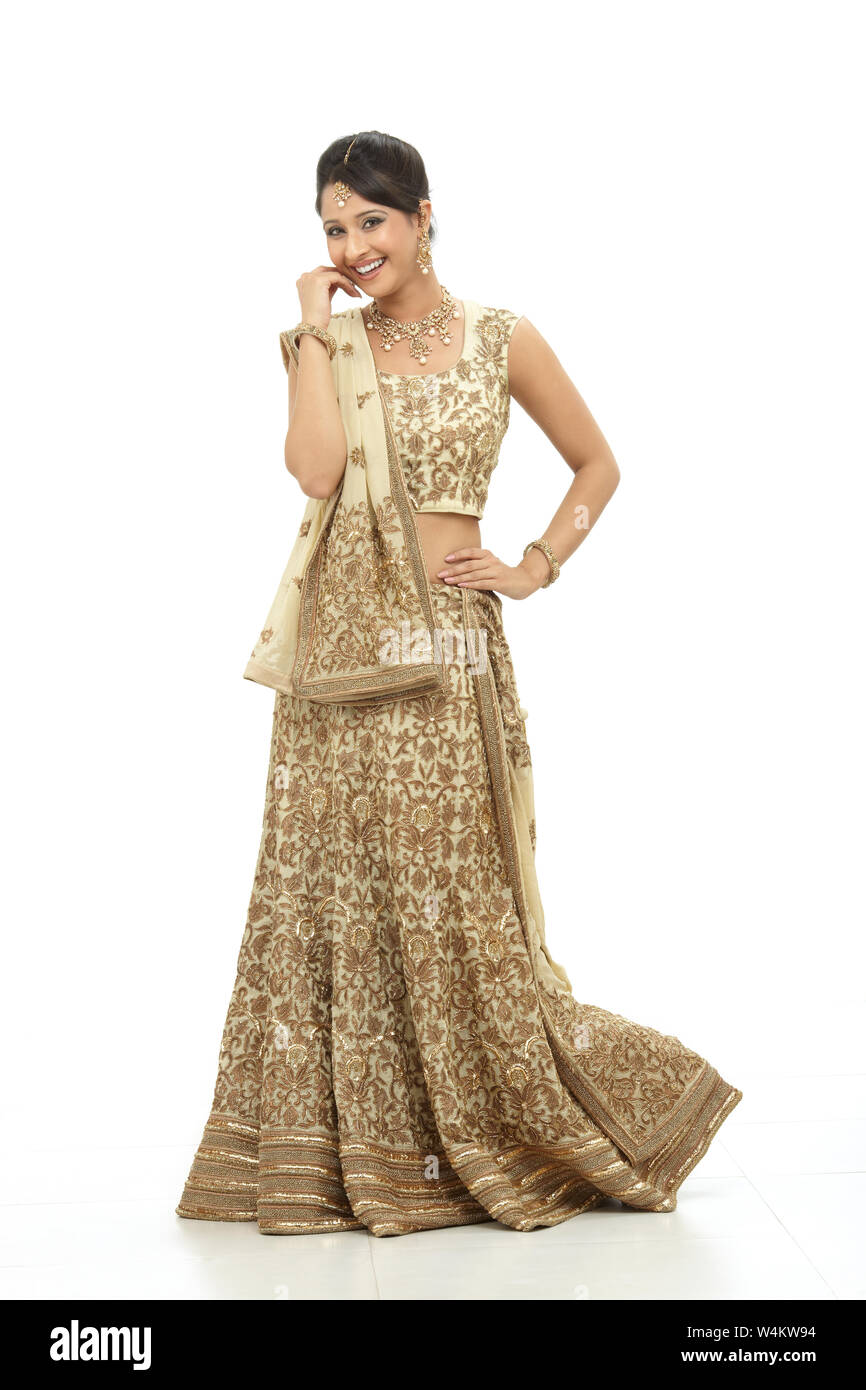 Indian bride standing and smiling Stock Photo - Alamy