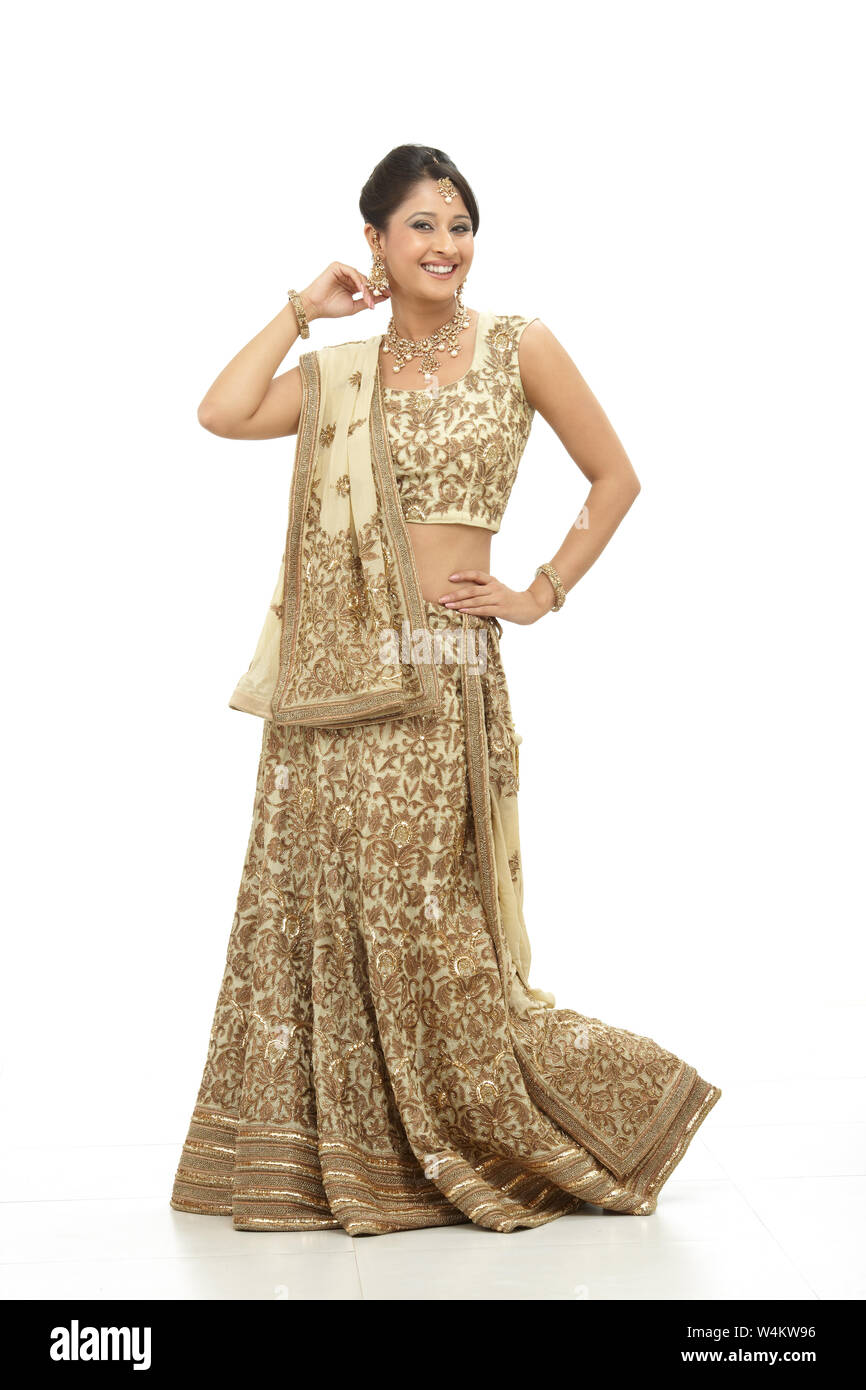 Indian bride standing and smiling Stock Photo - Alamy