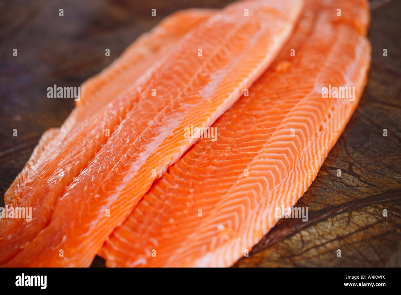 Fish Salmon on the cooking table of a cook Stock Photo - Alamy