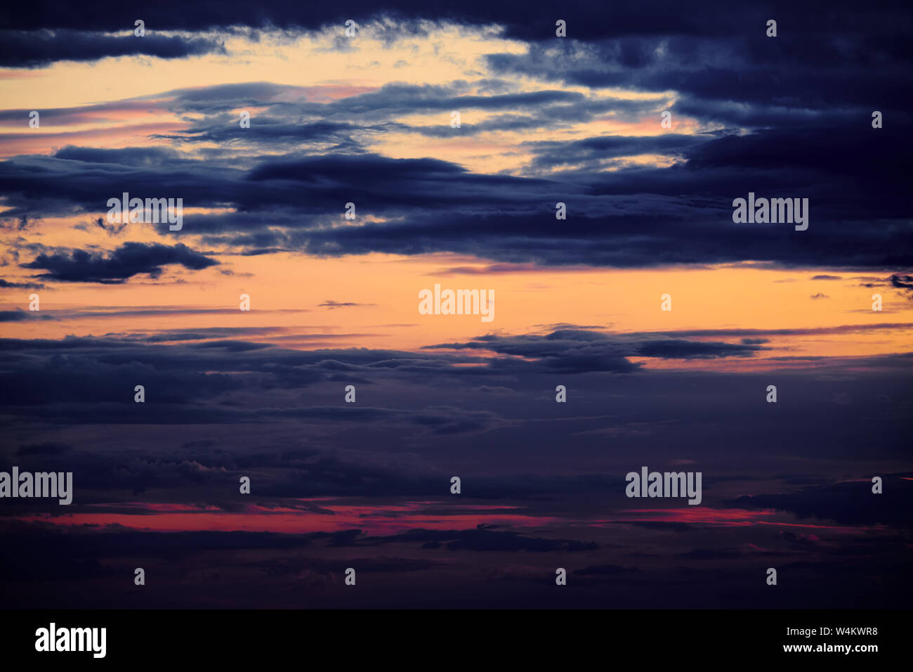 Beautiful sunset - dark sky with clouds and sunlight Stock Photo - Alamy