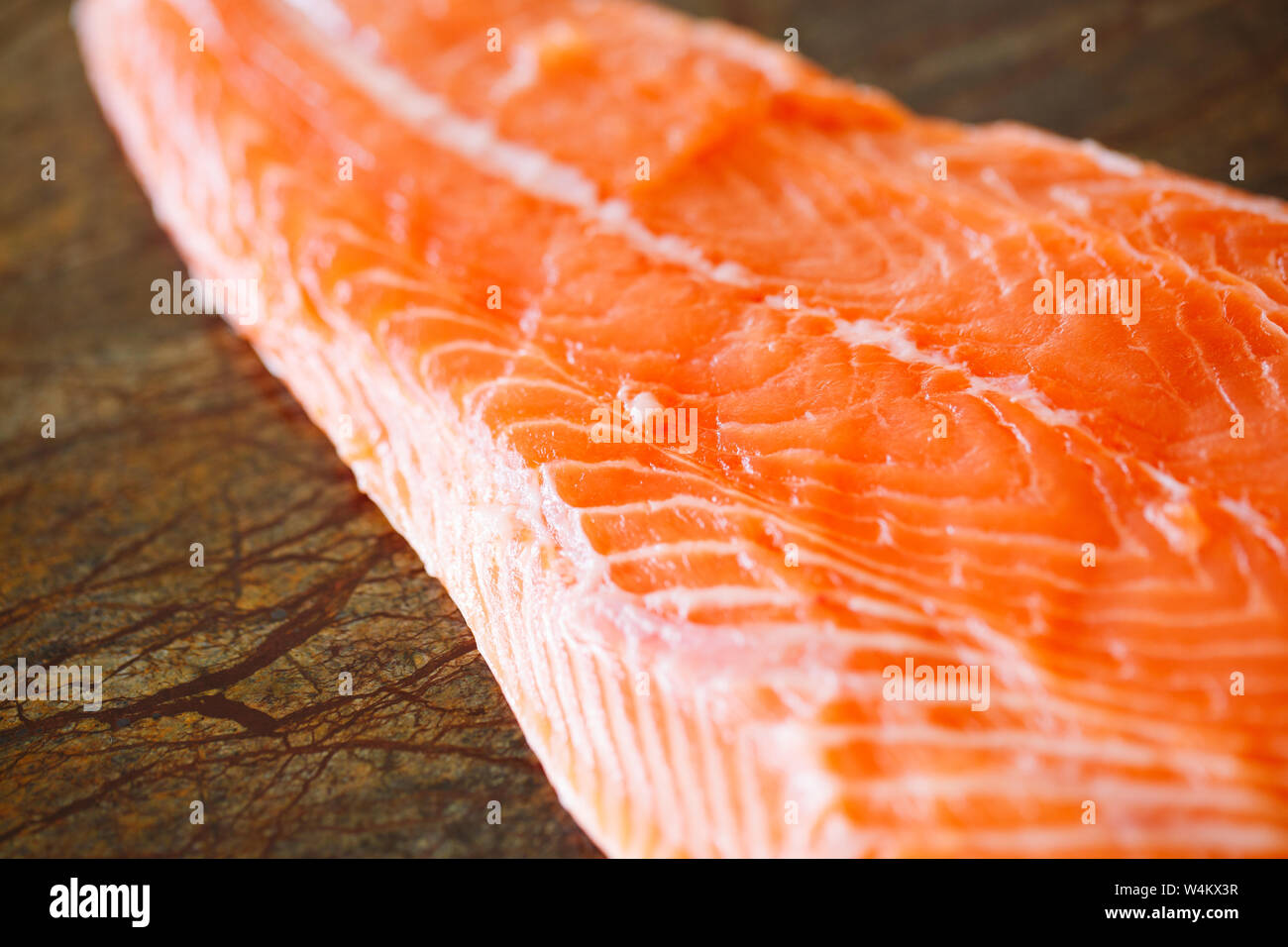 Fish Salmon on the cooking table of a cook Stock Photo - Alamy