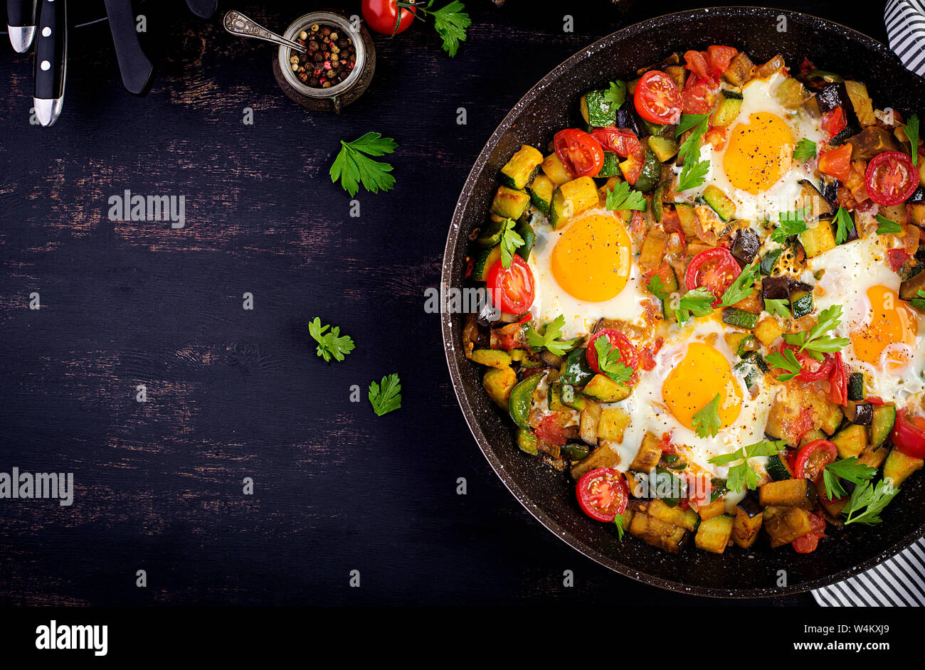 Late breakfast - fried eggs with vegetables. Shakshuka. Arabic cuisine ...