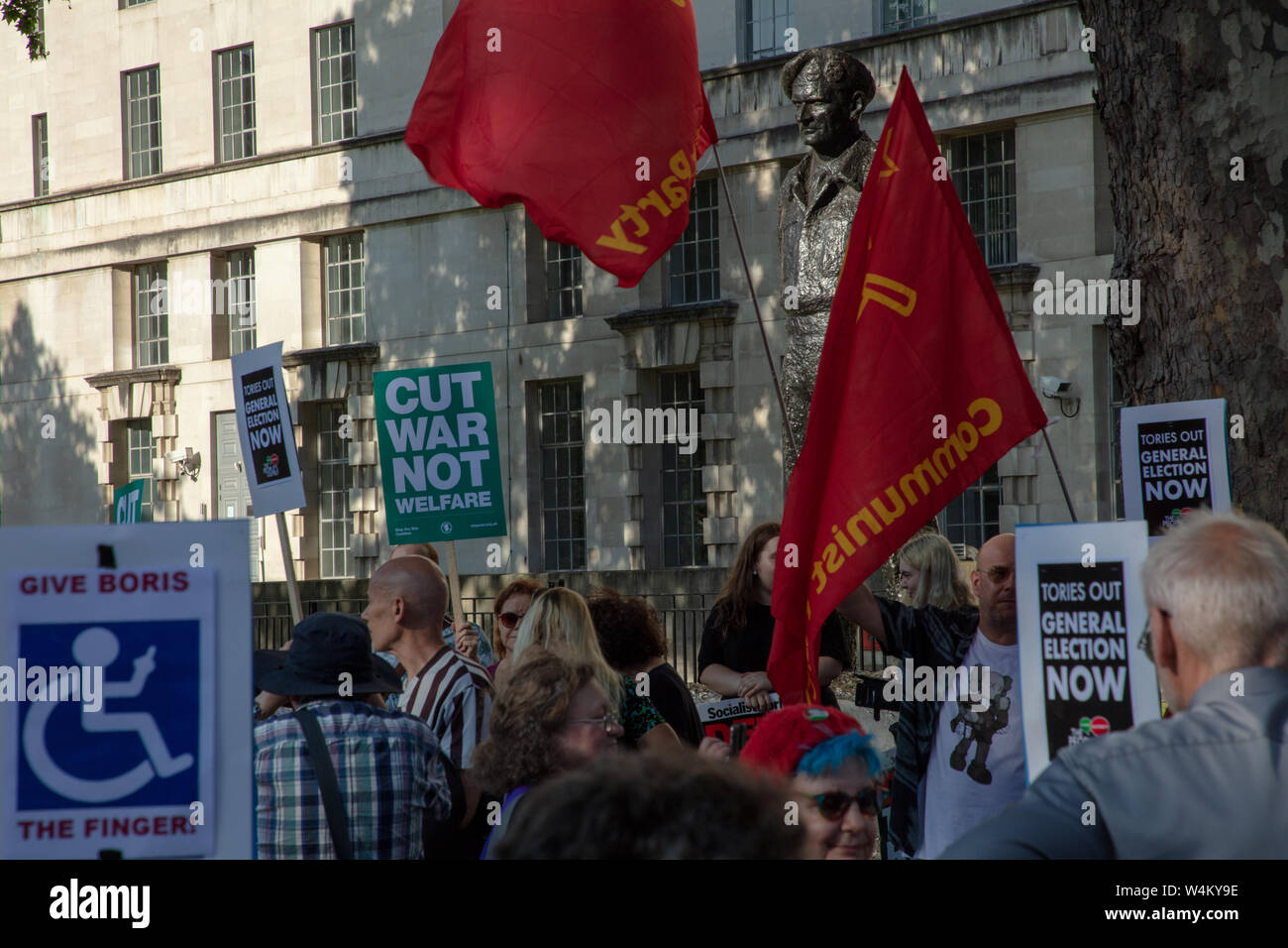 London, UK. 2019. Flags of the communist party near the statue of Field ...