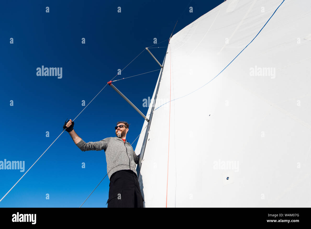 Sailing team operating windlass hi-res stock photography and images - Alamy