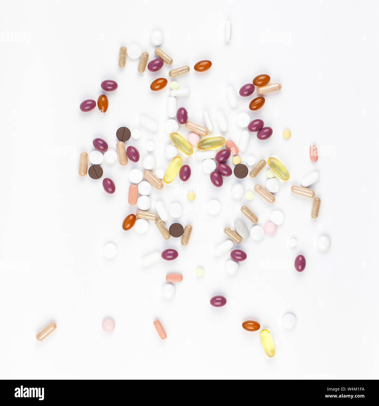 Nutritional supplement color pills isolated on white background with ...