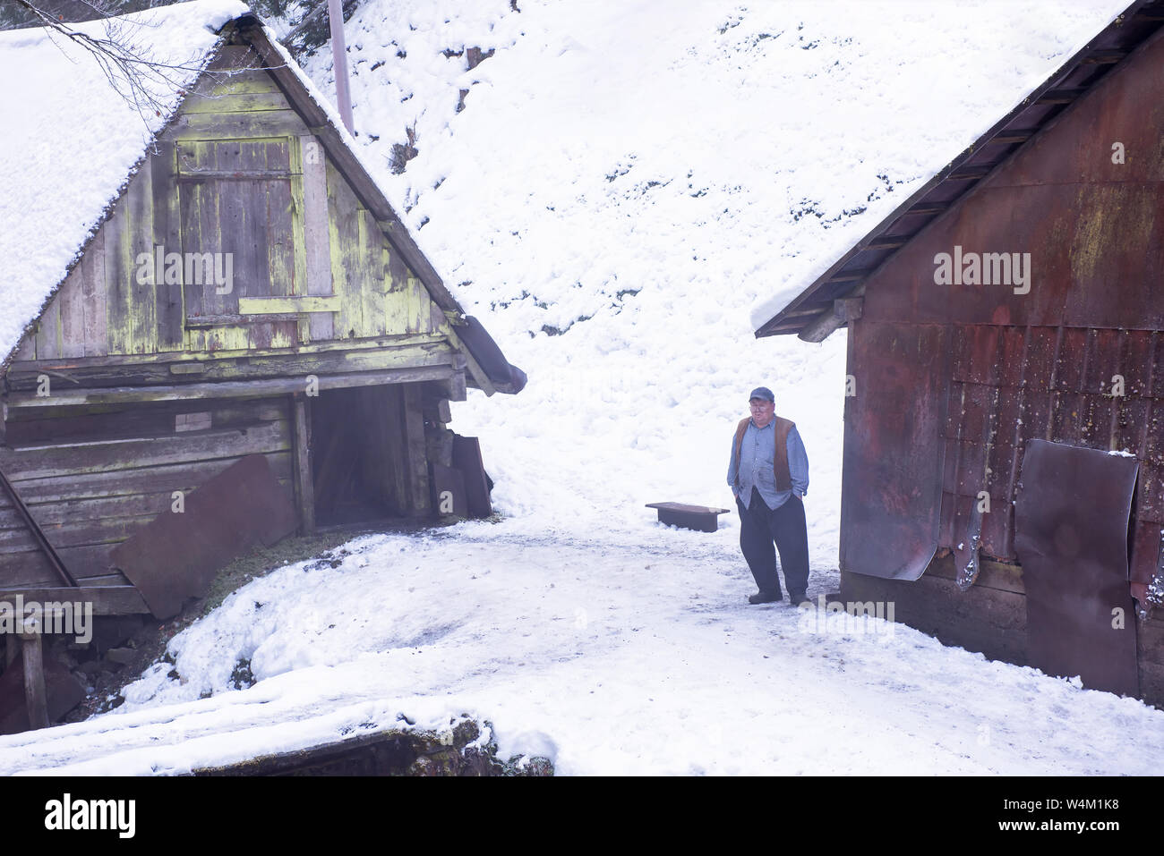 portrait of confident traditional senior blacksmith worker standing in ...