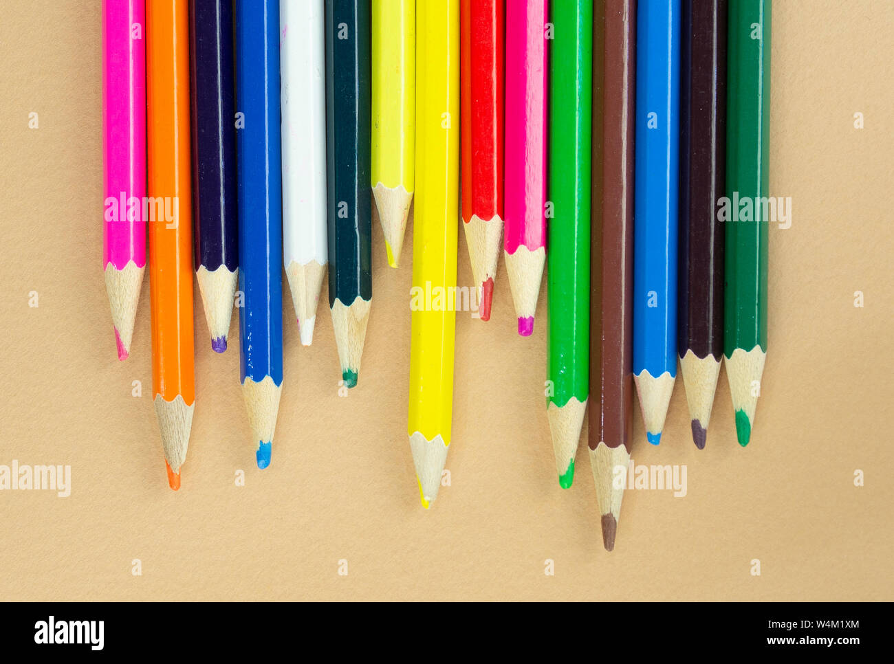 Lots of colorful pencils on a nice beige background Stock Photo - Alamy