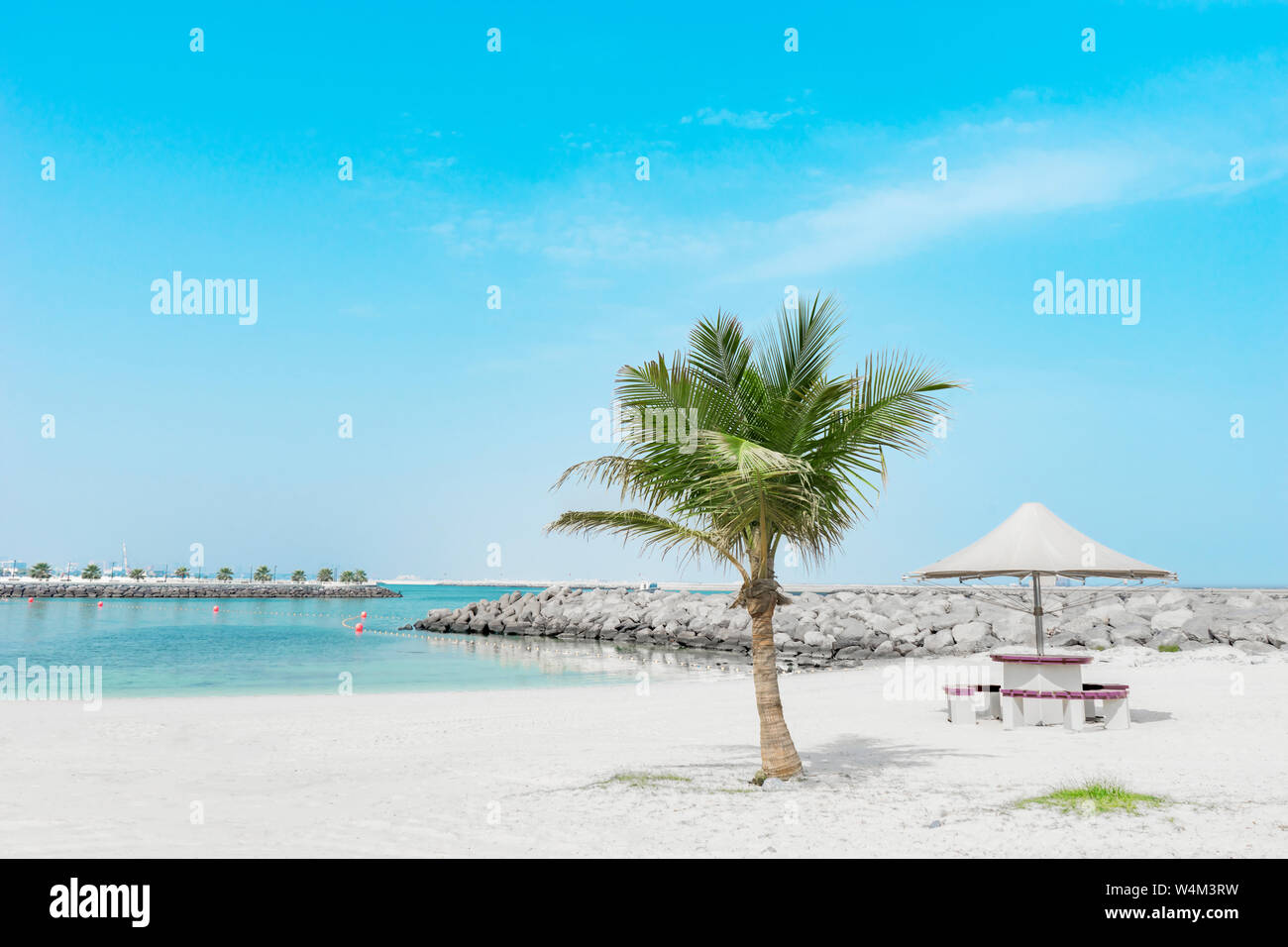 White sandy beach with blue lagoon and a place for contemplation. Al ...