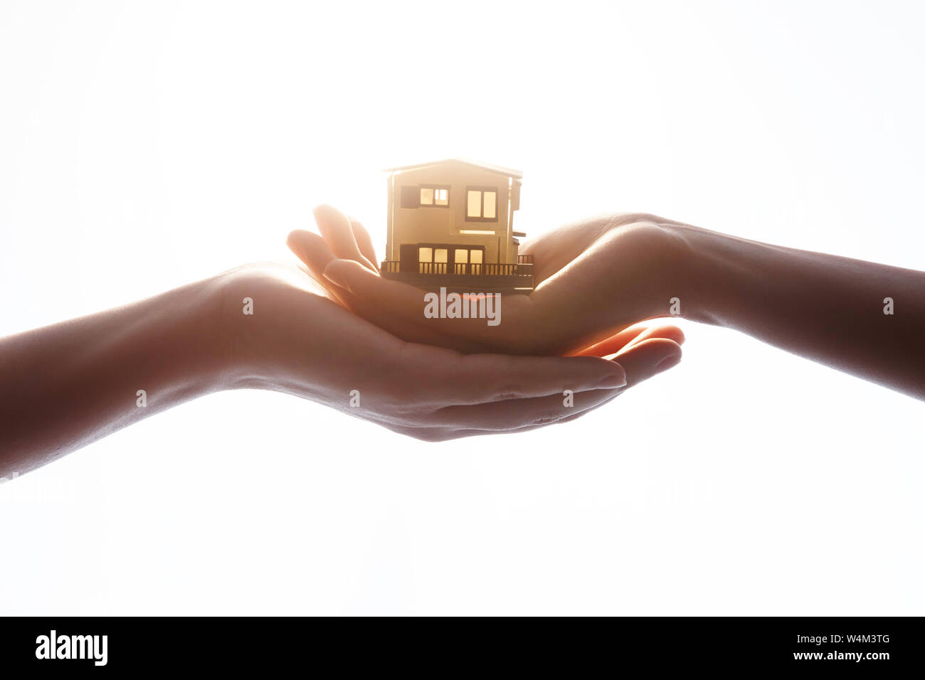 Building model in hand Stock Photo - Alamy