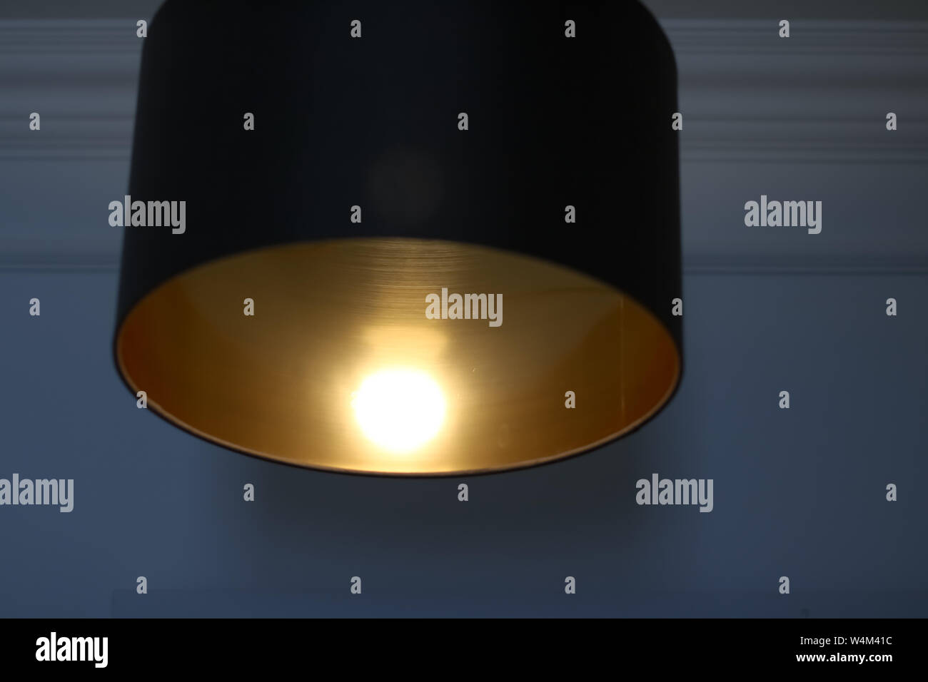 Interior design, indoor lamps and electricity concept - Golden lamp in ...