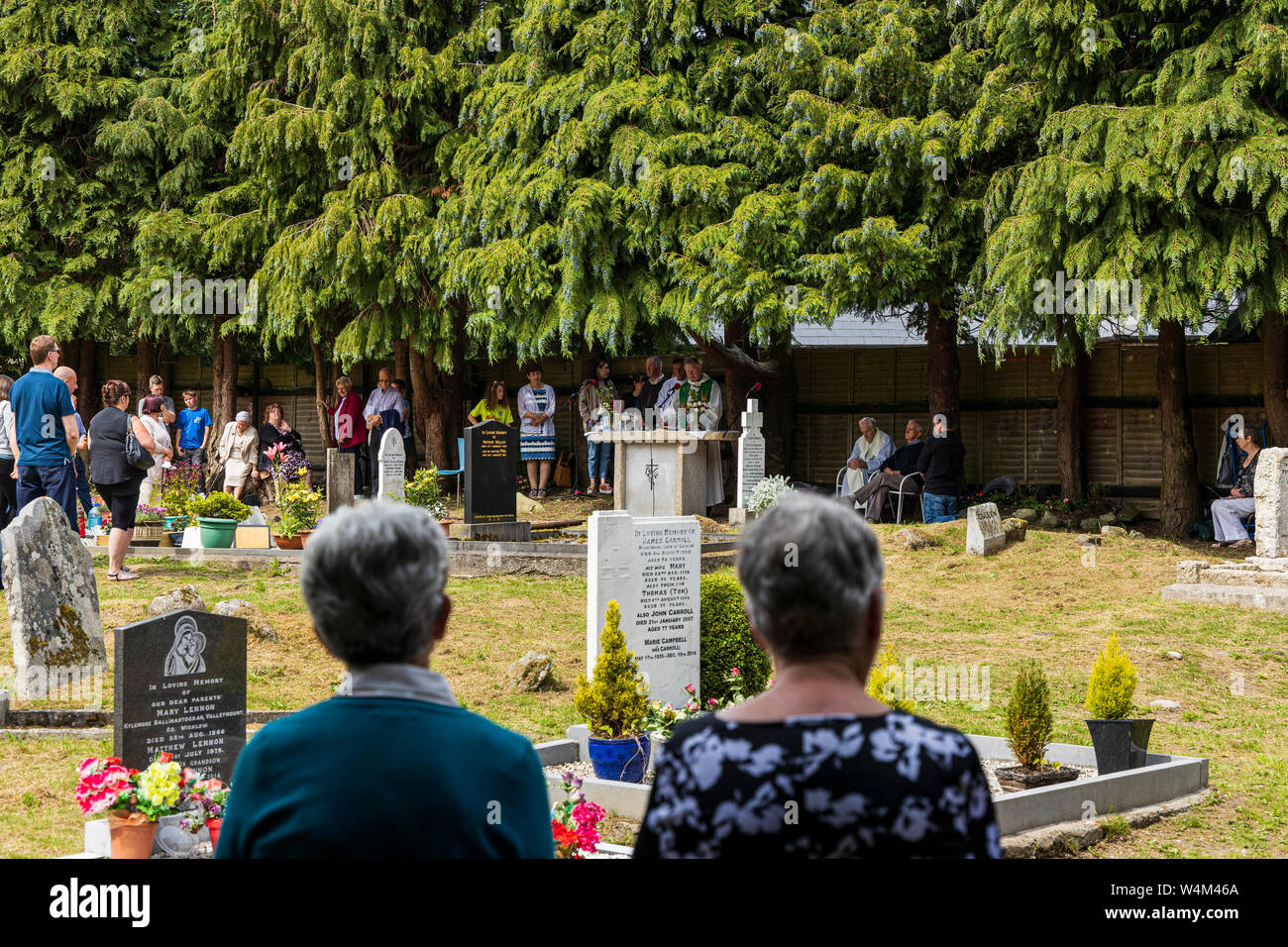 Outdoor mass in Templeboden cemetery, amongst the gravestones on a July ...