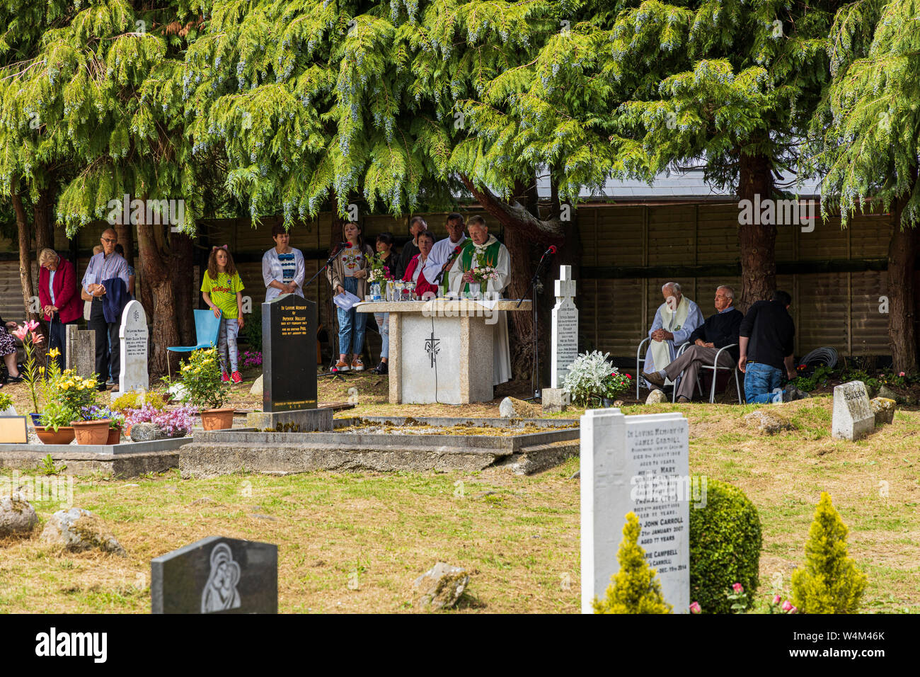 Outdoor mass in Templeboden cemetery, amongst the gravestones on a July ...