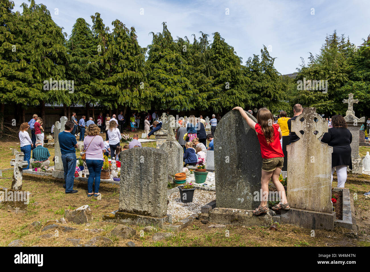 Outdoor mass in Templeboden cemetery, amongst the gravestones on a July ...