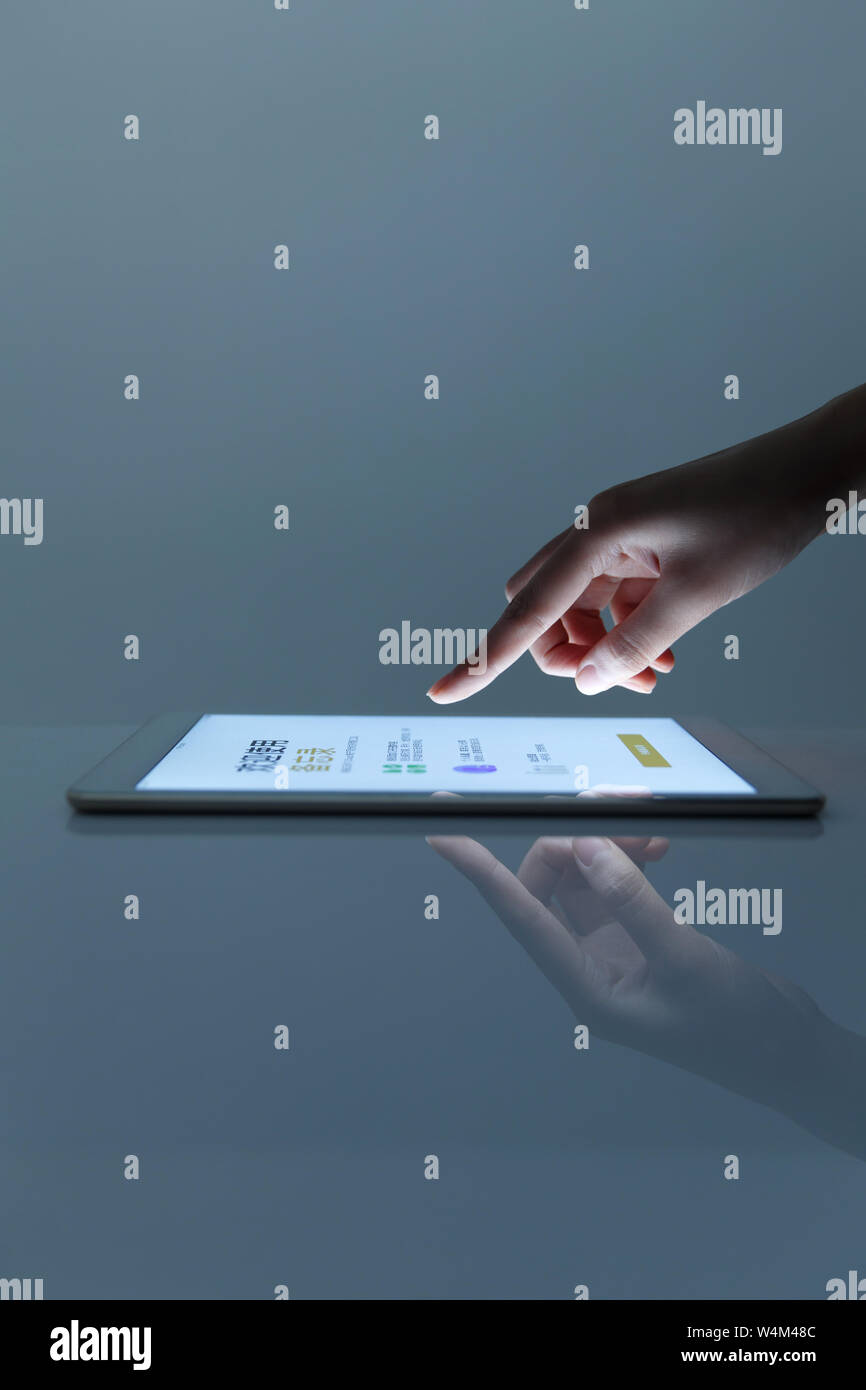 Use the tablet Stock Photo - Alamy