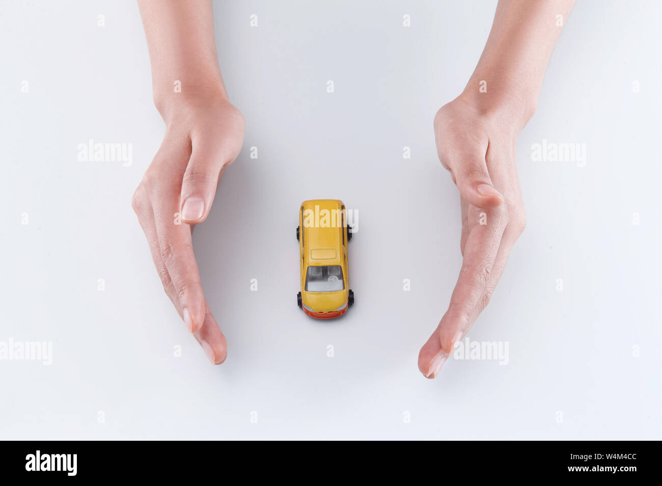 Hand and car model Stock Photo - Alamy