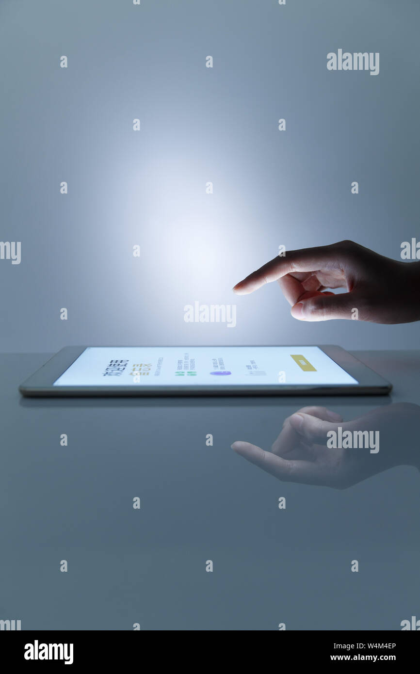 Use the tablet Stock Photo - Alamy