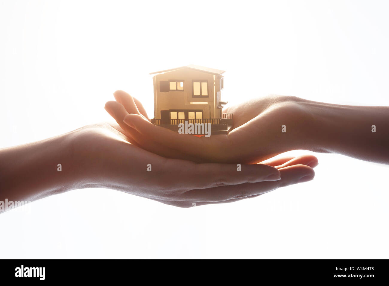 Building model in hand Stock Photo - Alamy