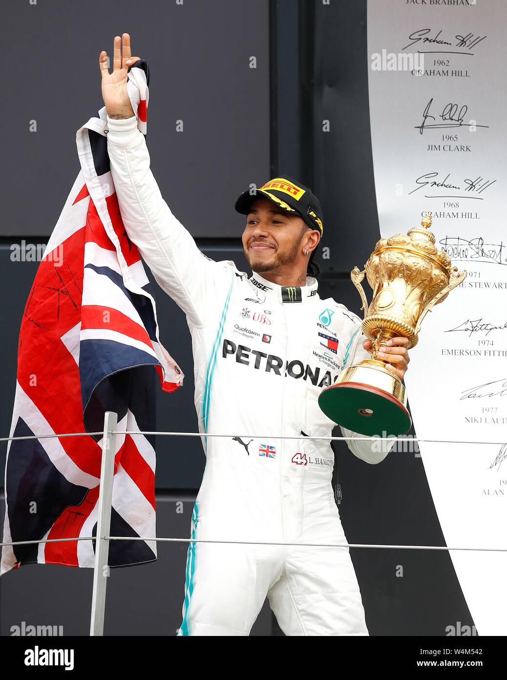Mercedes driver Lewis Hamilton celebrates winning the British Grand ...