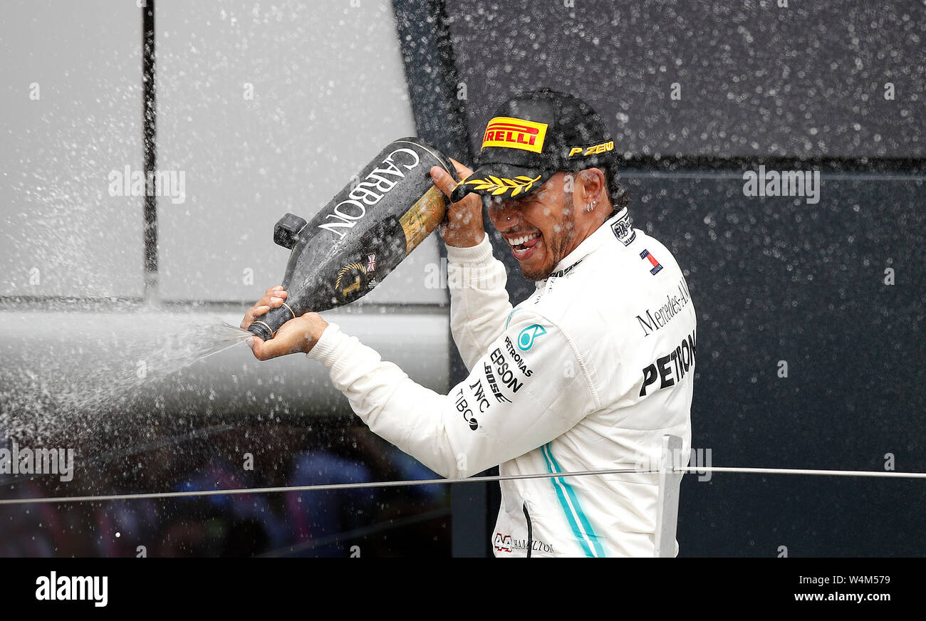Mercedes driver Lewis Hamilton celebrates winning the British Grand ...