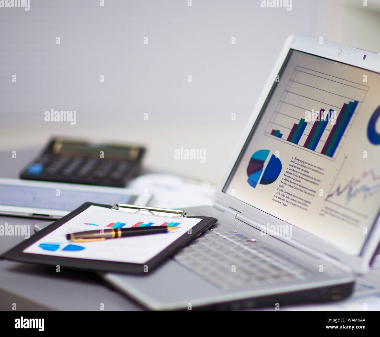 Businessman analyzing investment charts with laptop. Accounting Stock ...