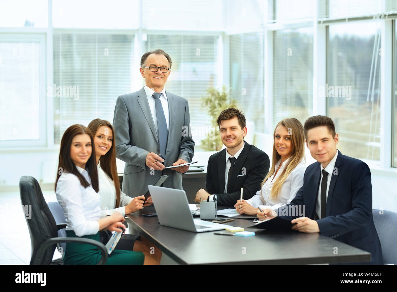 successful businessman and business team at a seminar in modern office ...