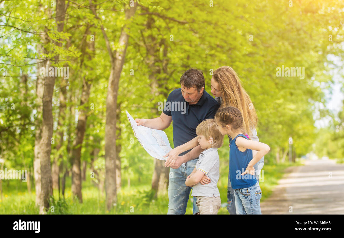 Family on vacation in the park exploring the local attractions on the ...