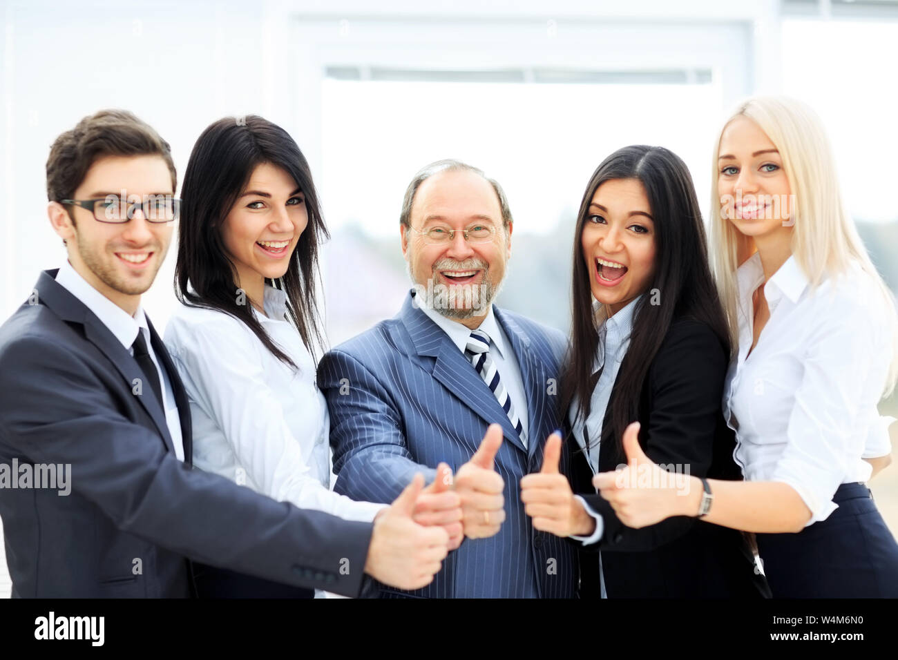 successful friendly business team on office background all showing ...