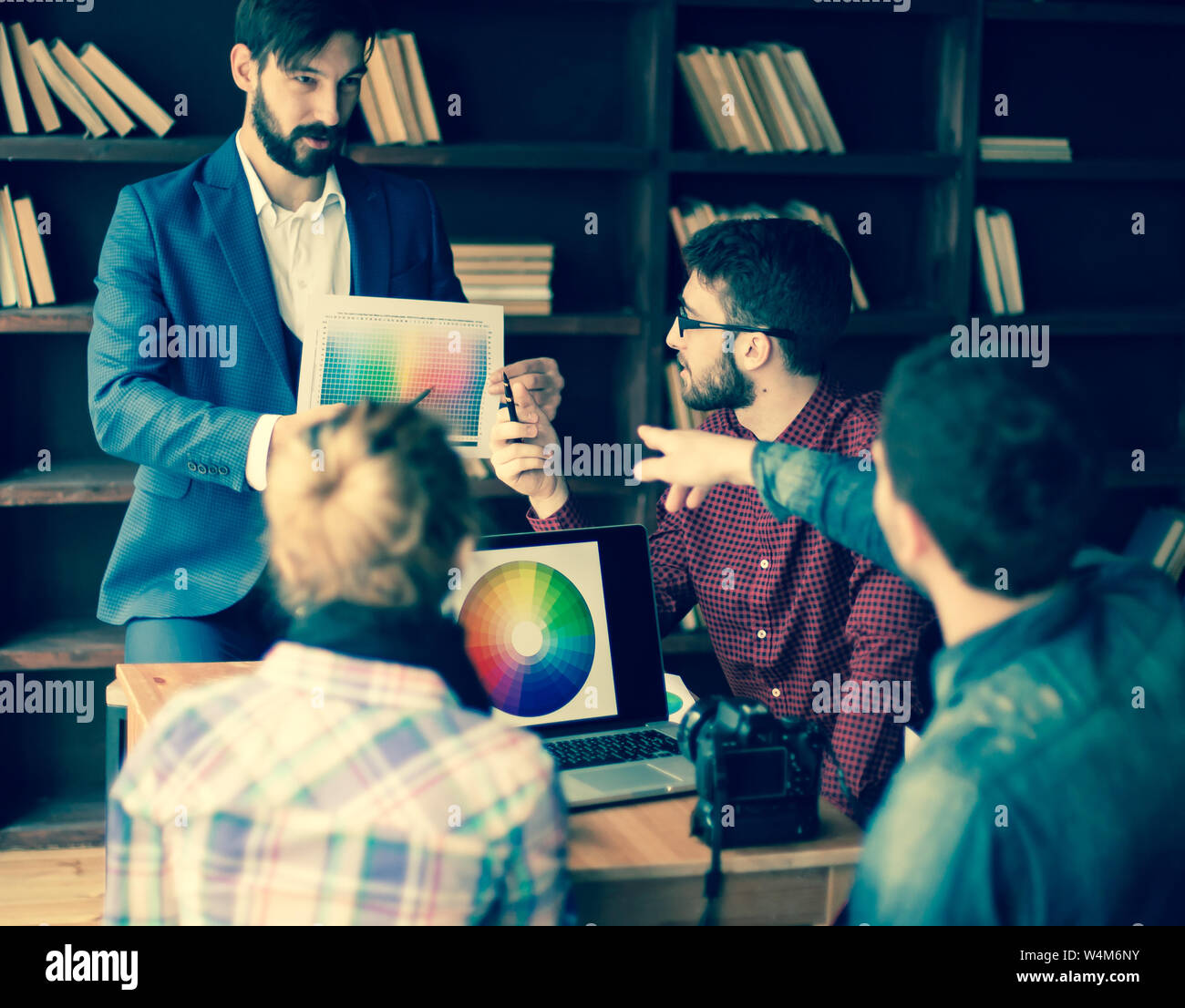group of designers develop a new color palette in the workplace in a ...