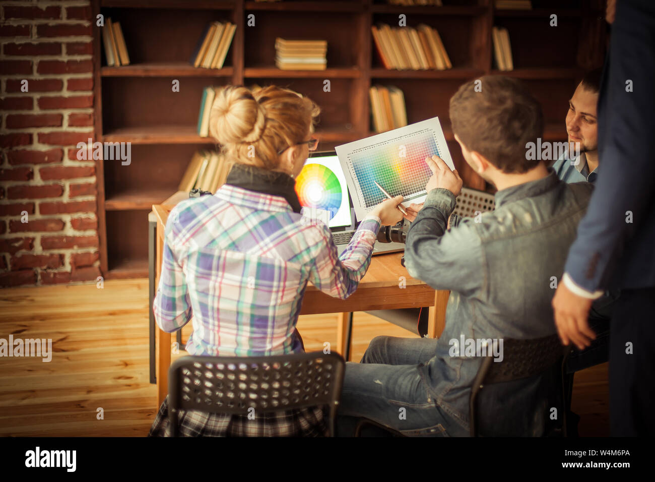 group of creative designers work with a new color palette in the ...